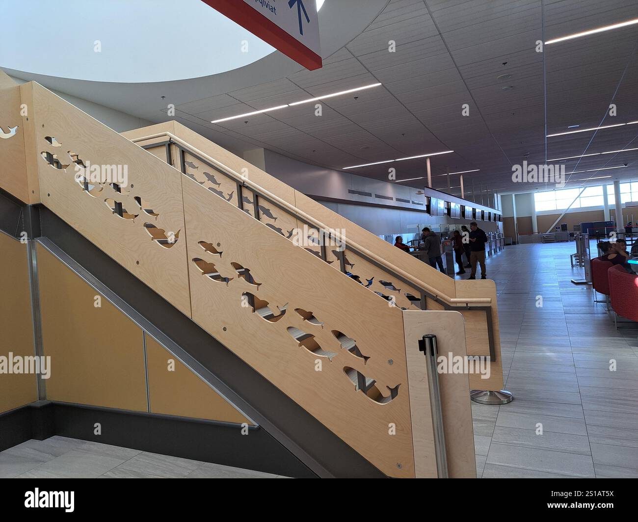 Cutouts of arctic char fish design on the railings of the stairs inside ...