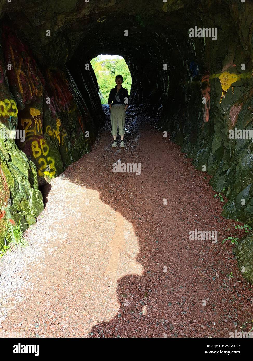 The tunnel through solid wall of rock in Brigus, Newfoundland ...