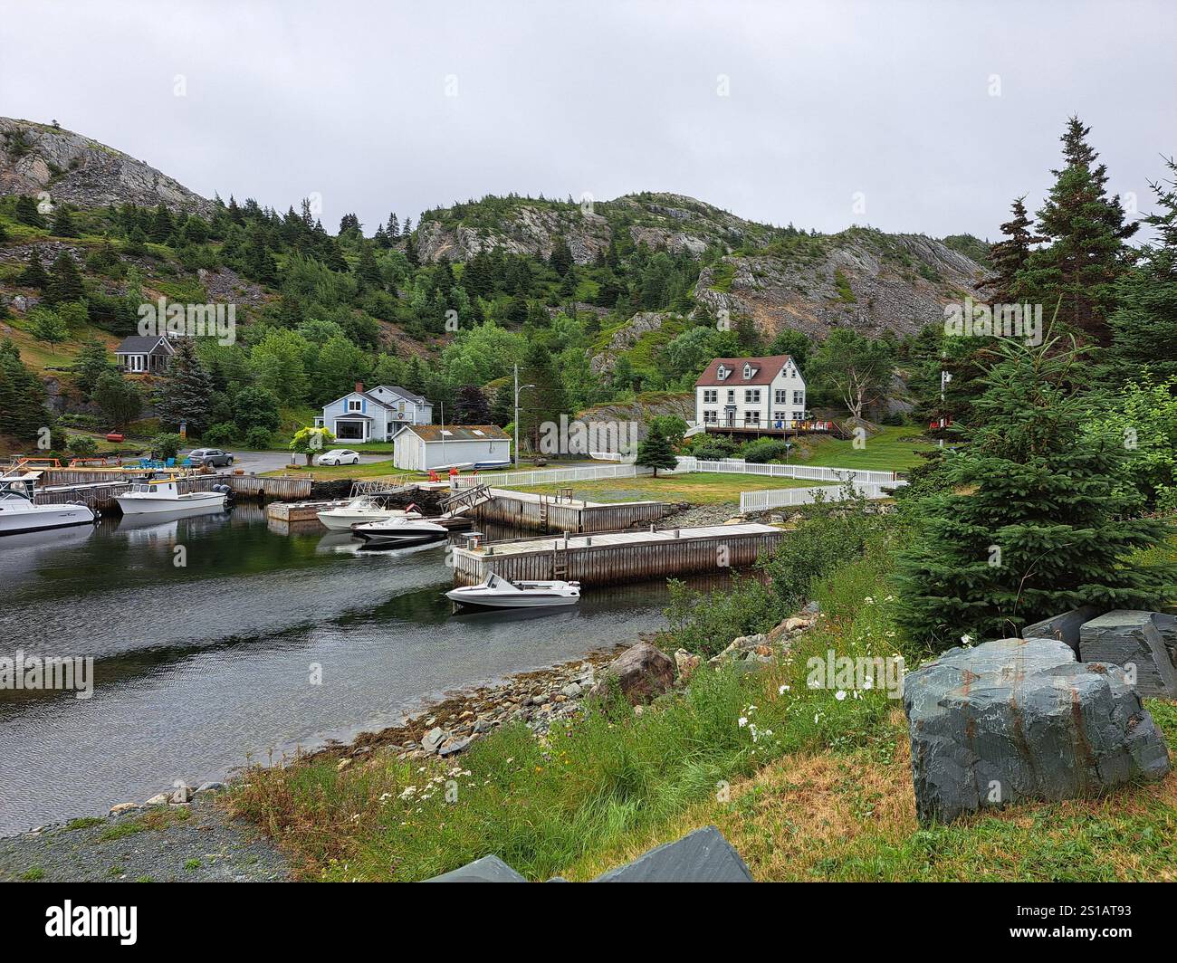 Waterfront homes and boats docked in Brigus, Newfoundland & Labrador ...