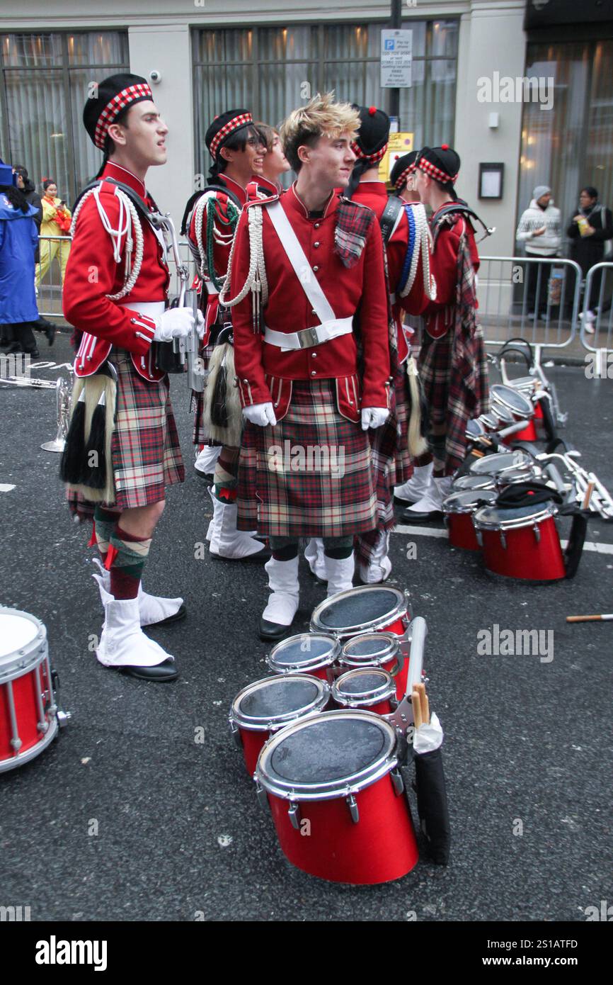 Members of the RHS Kiltie Wind Ensemble take a break ahead of the ...