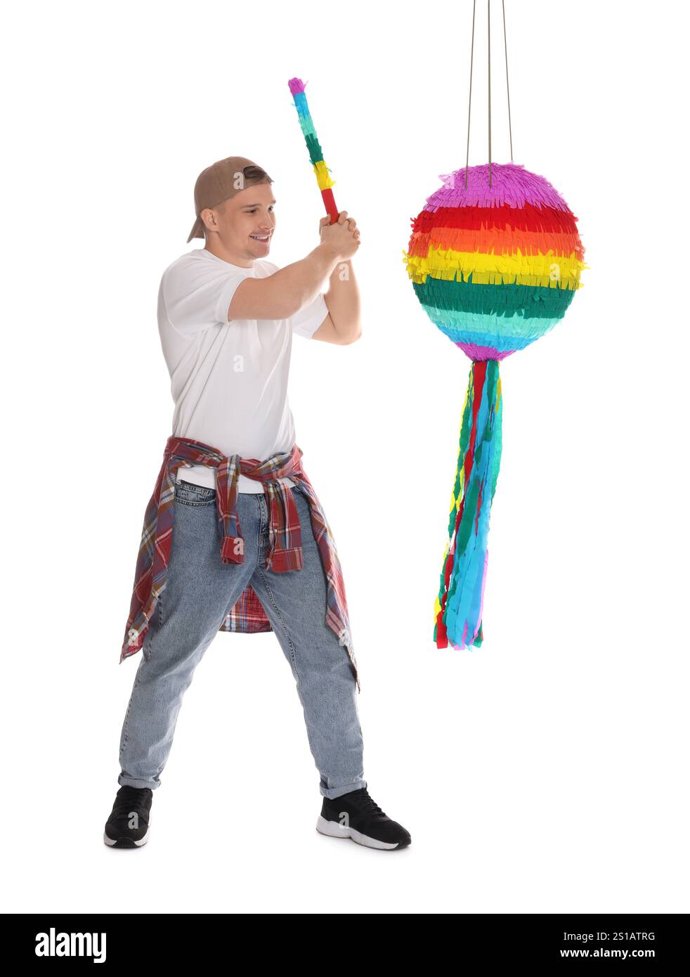 Happy man breaking pinata on white background Stock Photo - Alamy