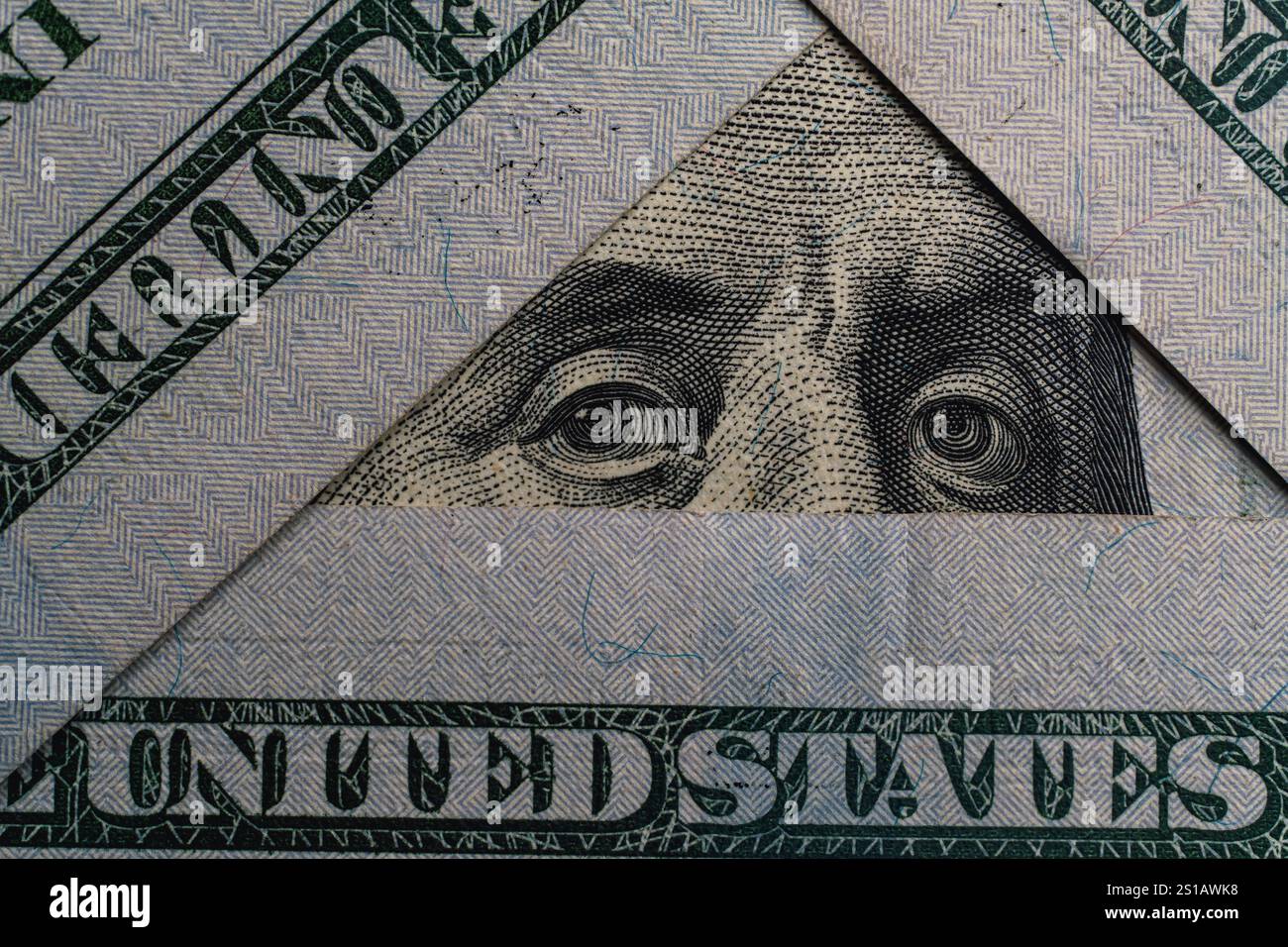 President of Benjamin Franklin's eyes in a triangle of hundred dollar ...