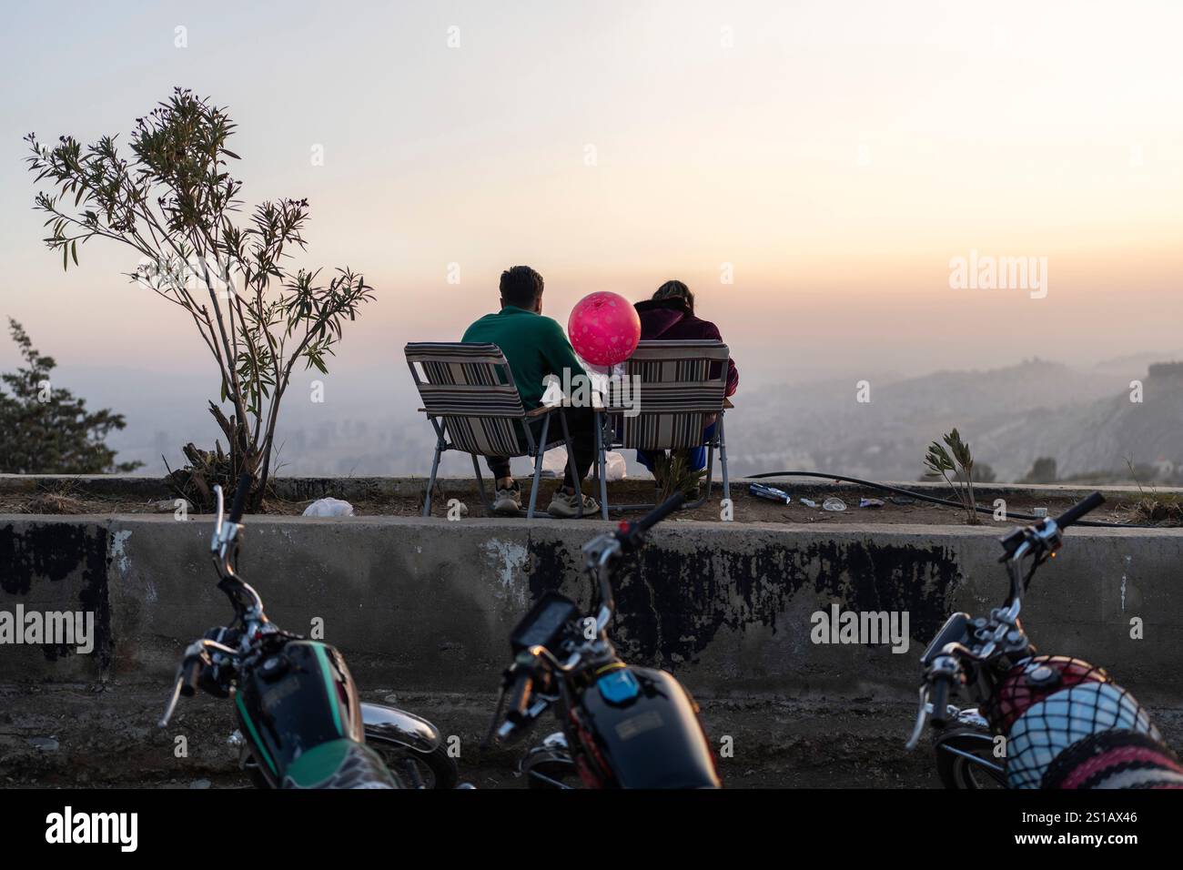 A couple watches the sunset atop Mount Qassioun, which was opened to ...