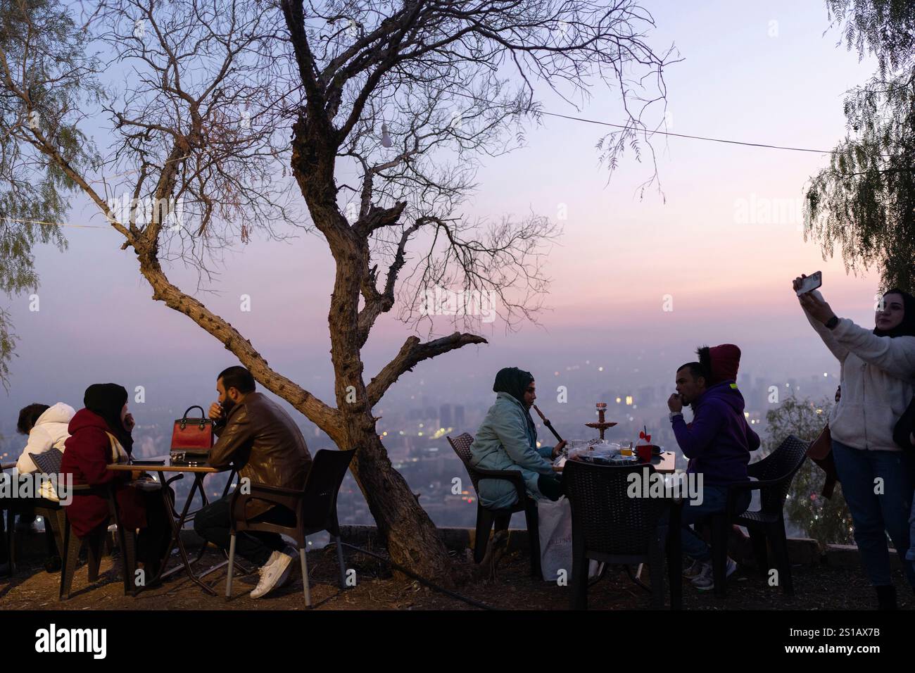 People gather atop Mount Qassioun, overlooking to the city and was ...