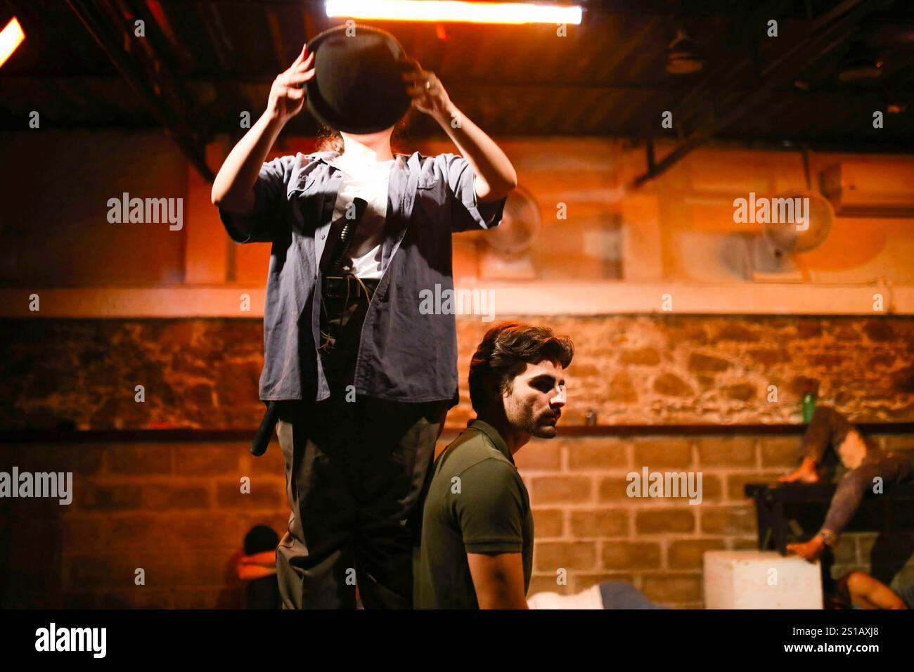 Student actors Gabriele Cardoso (left) and San Lima (right) perform in ...