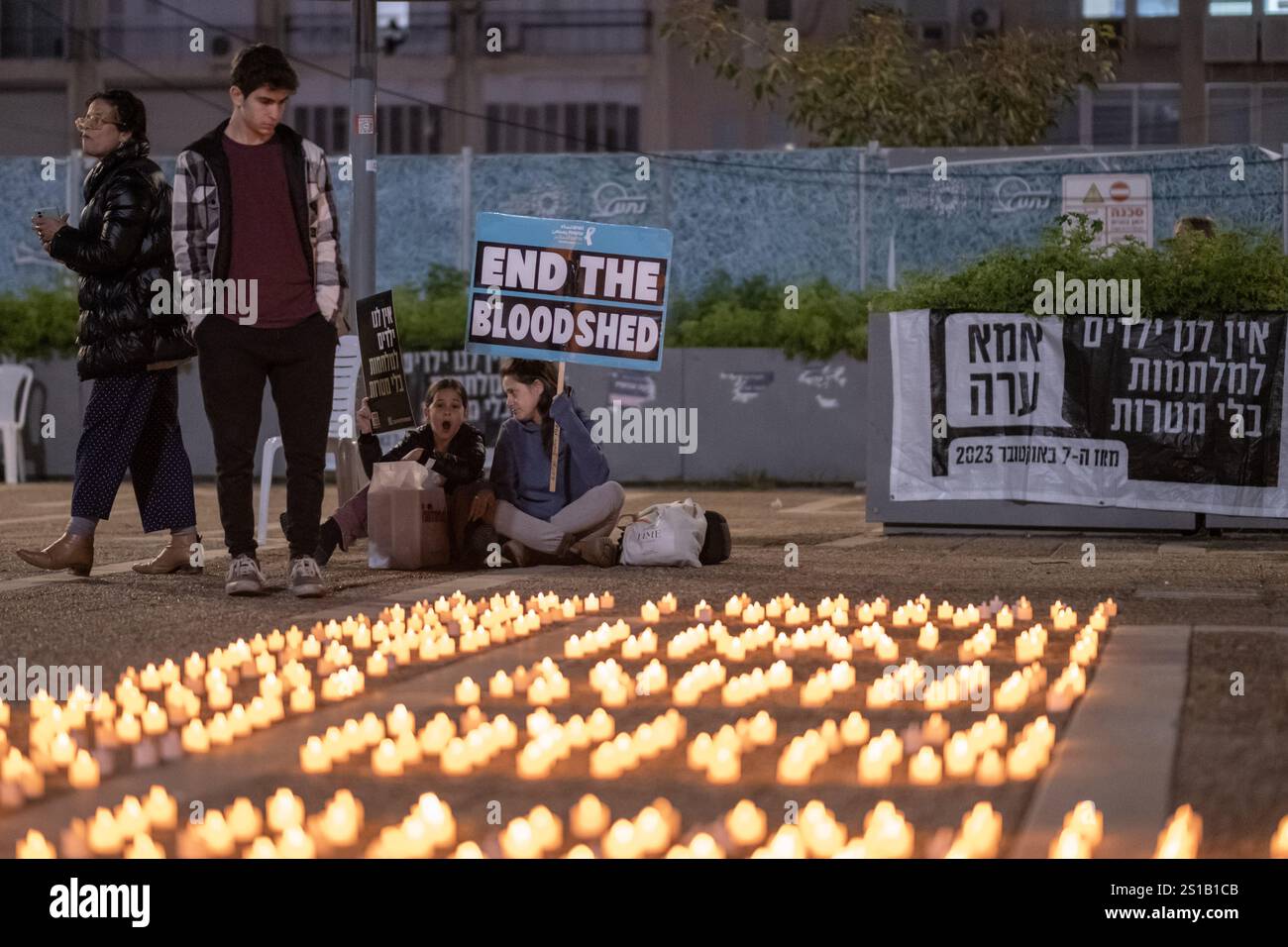 Tel Aviv, Israel. 2nd Jan, 2025. Religious people light Chanukah ...