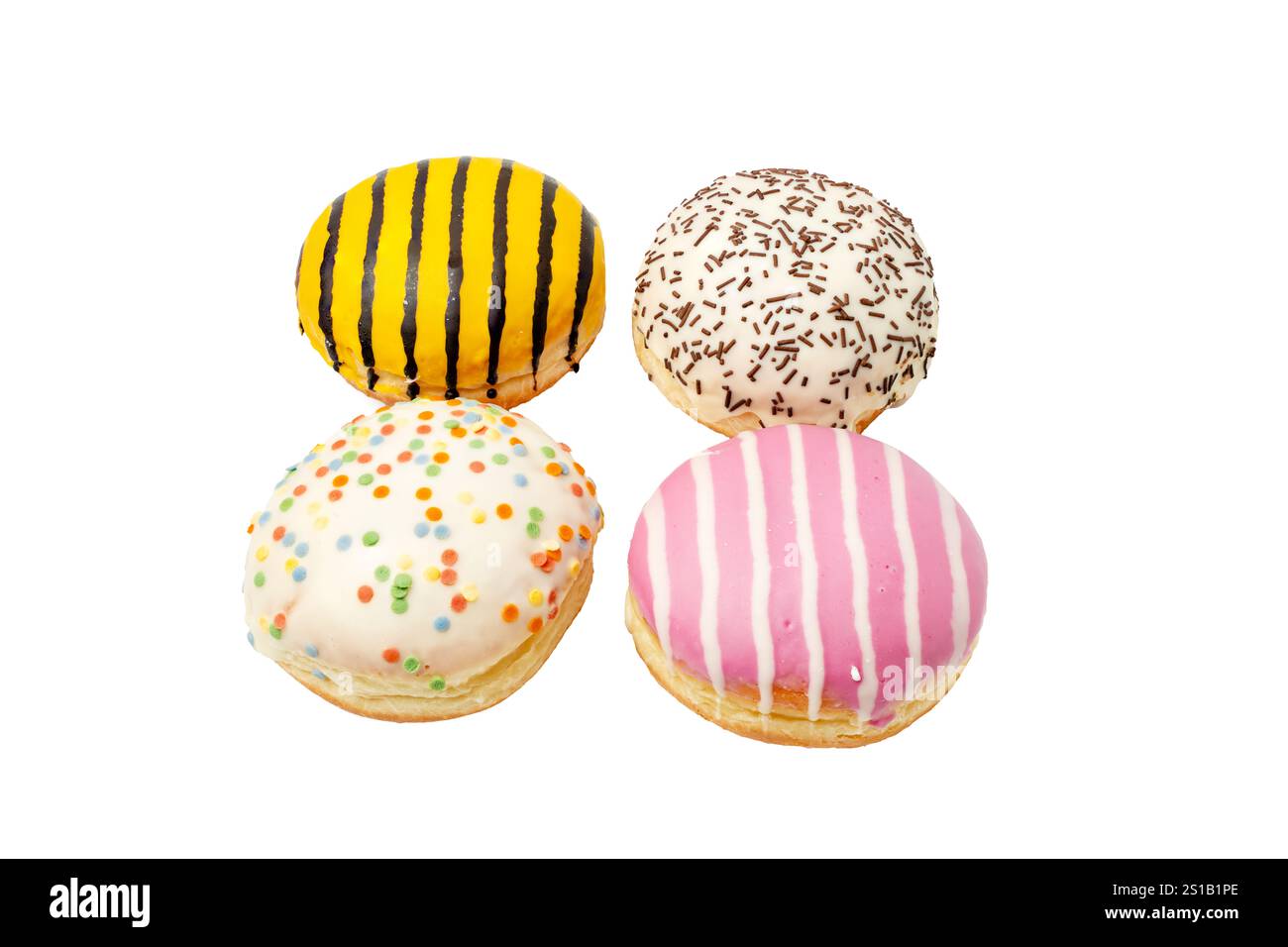 Four donuts of different colors and toppings. Donuts are laid out in a ...