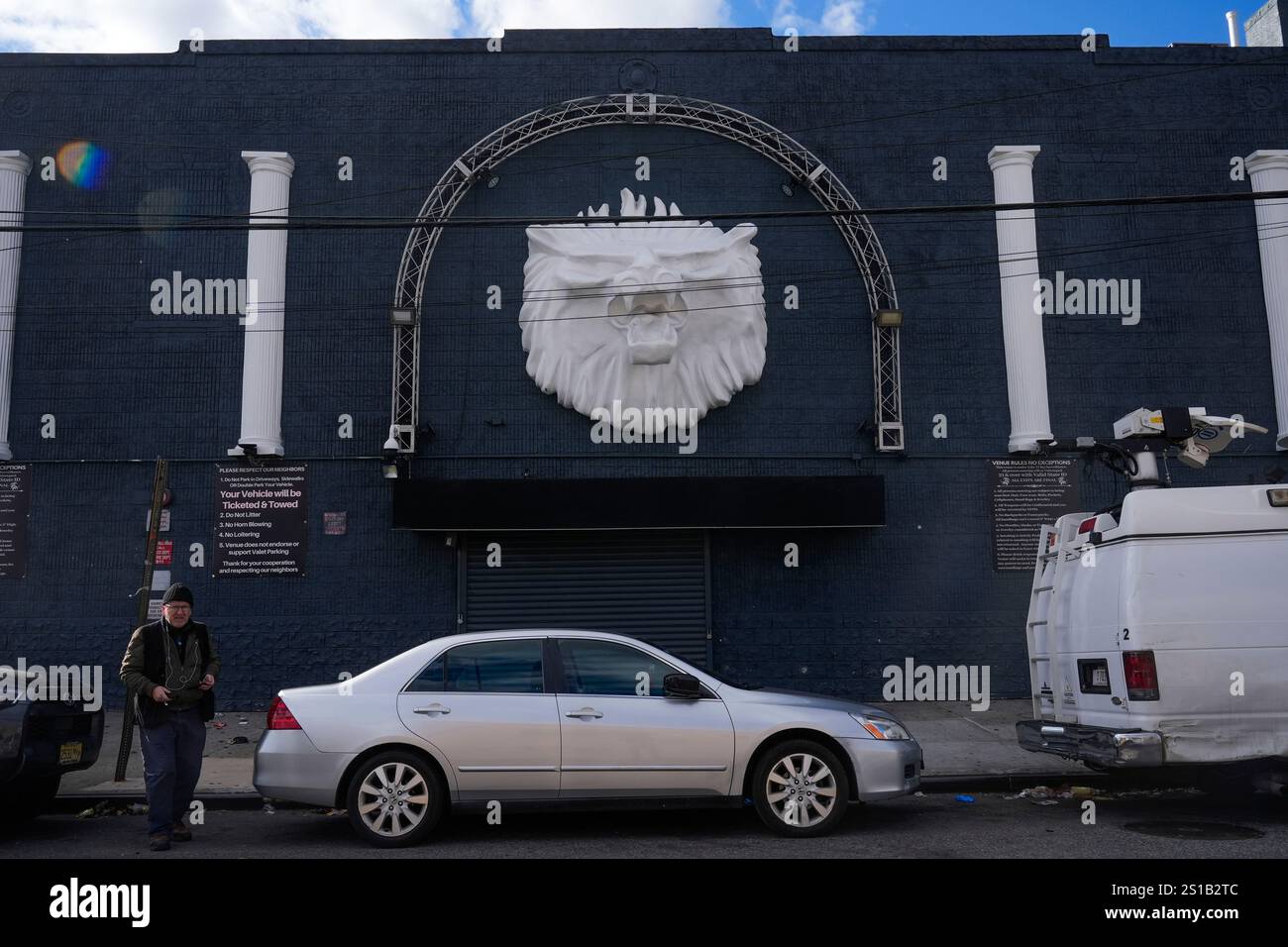 Members of the media work in front of the nightclub Amazura in the ...