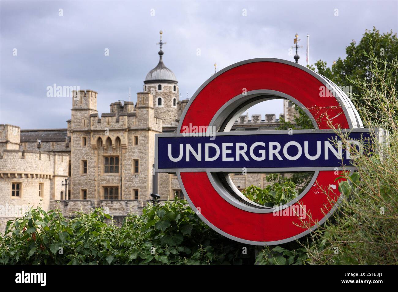 Underground railway sign close up with Tower of London in background ...