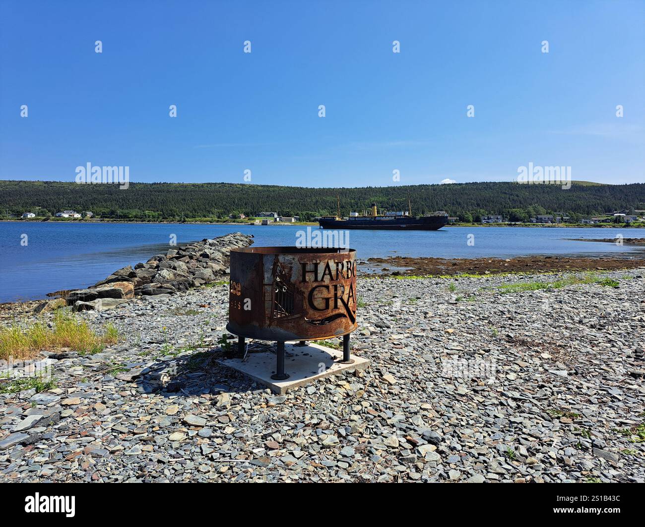 Harbour Grace sign on a fire pit on the beach in Harbour Grace ...