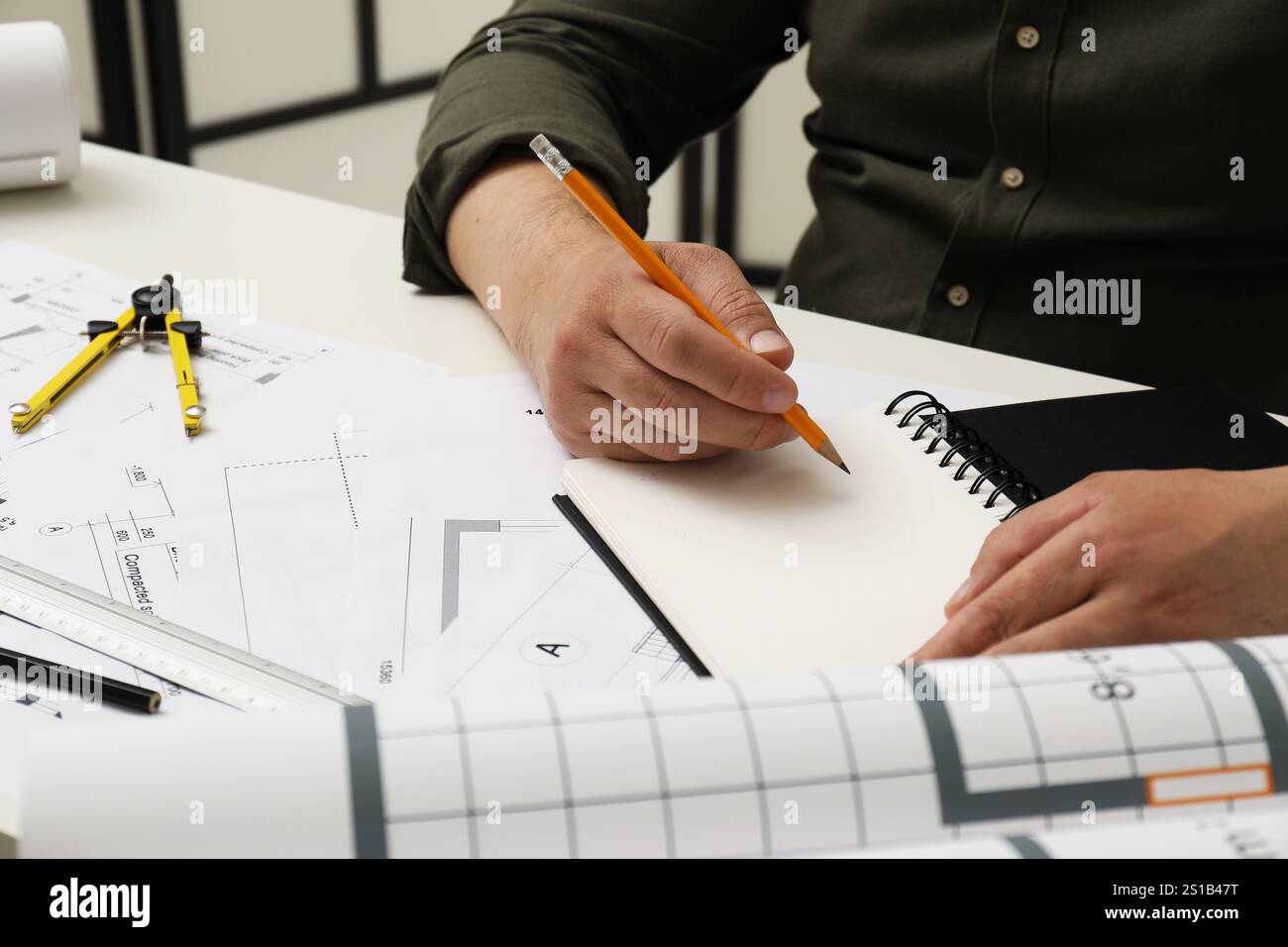 Architect working with project, closeup. Different technical drawings on white table Stock Photo ...