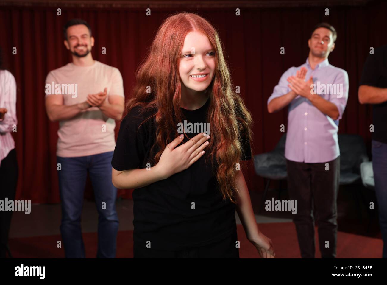 Professional actors bowing on stage in theatre Stock Photo - Alamy