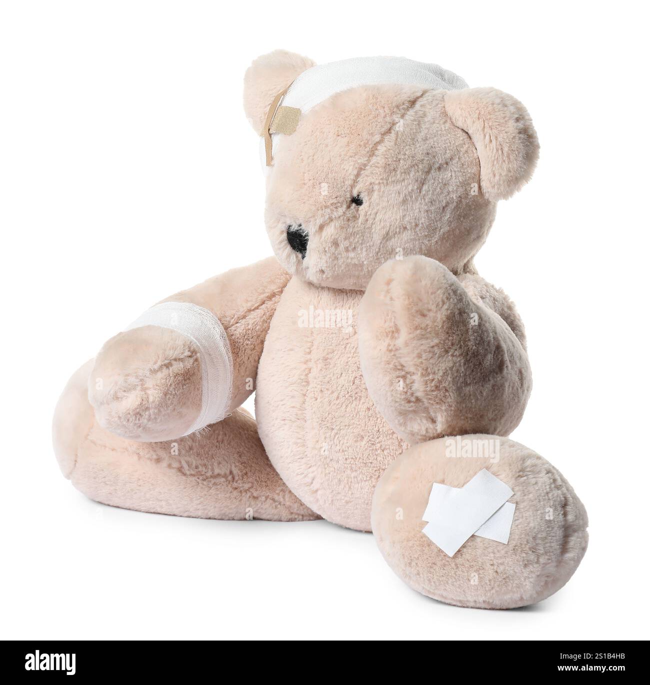 Teddy bear with bandages and adhesive medical plasters isolated on ...