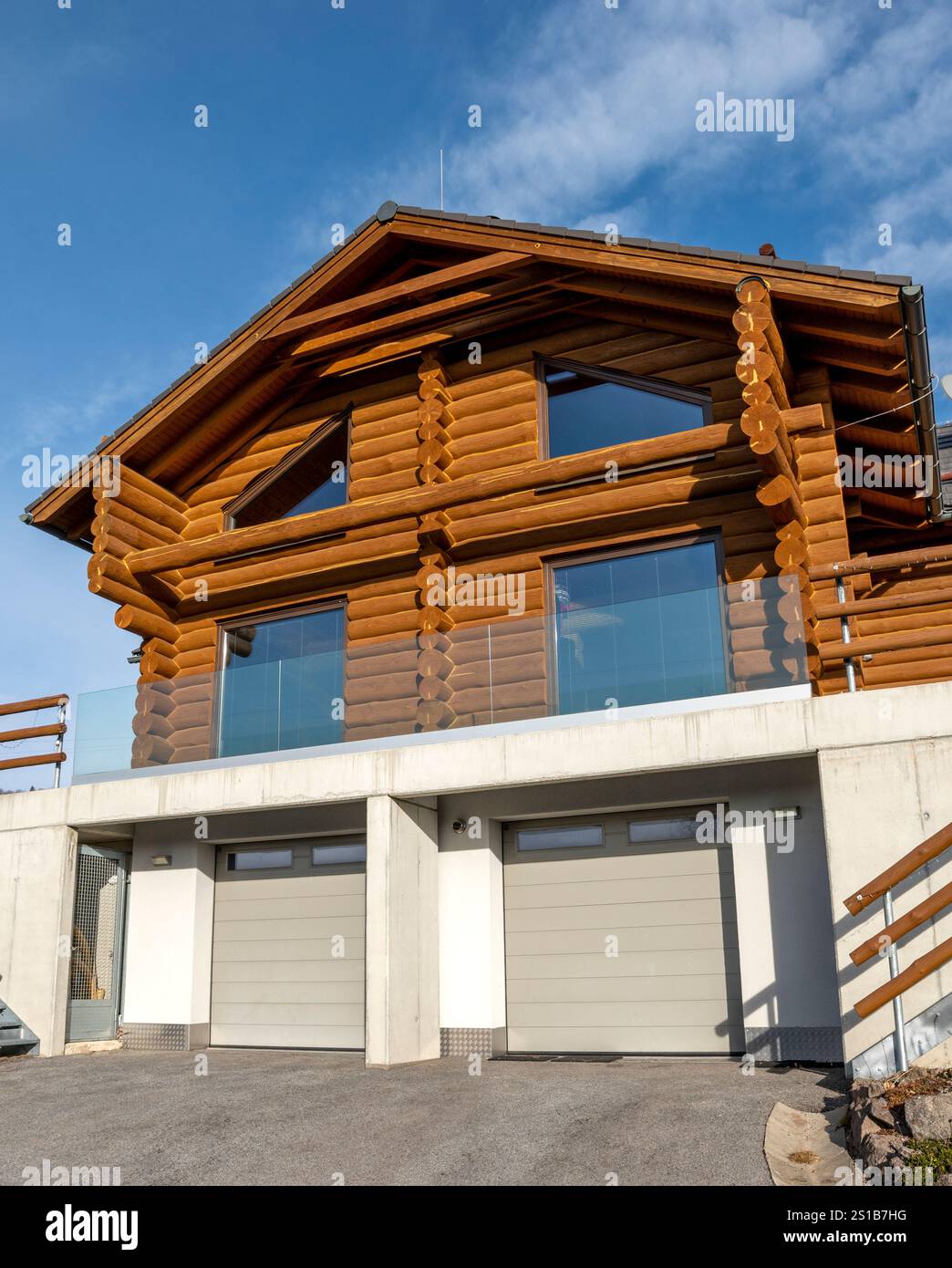 House made of wooden logs. Modern Log house Stock Photo - Alamy