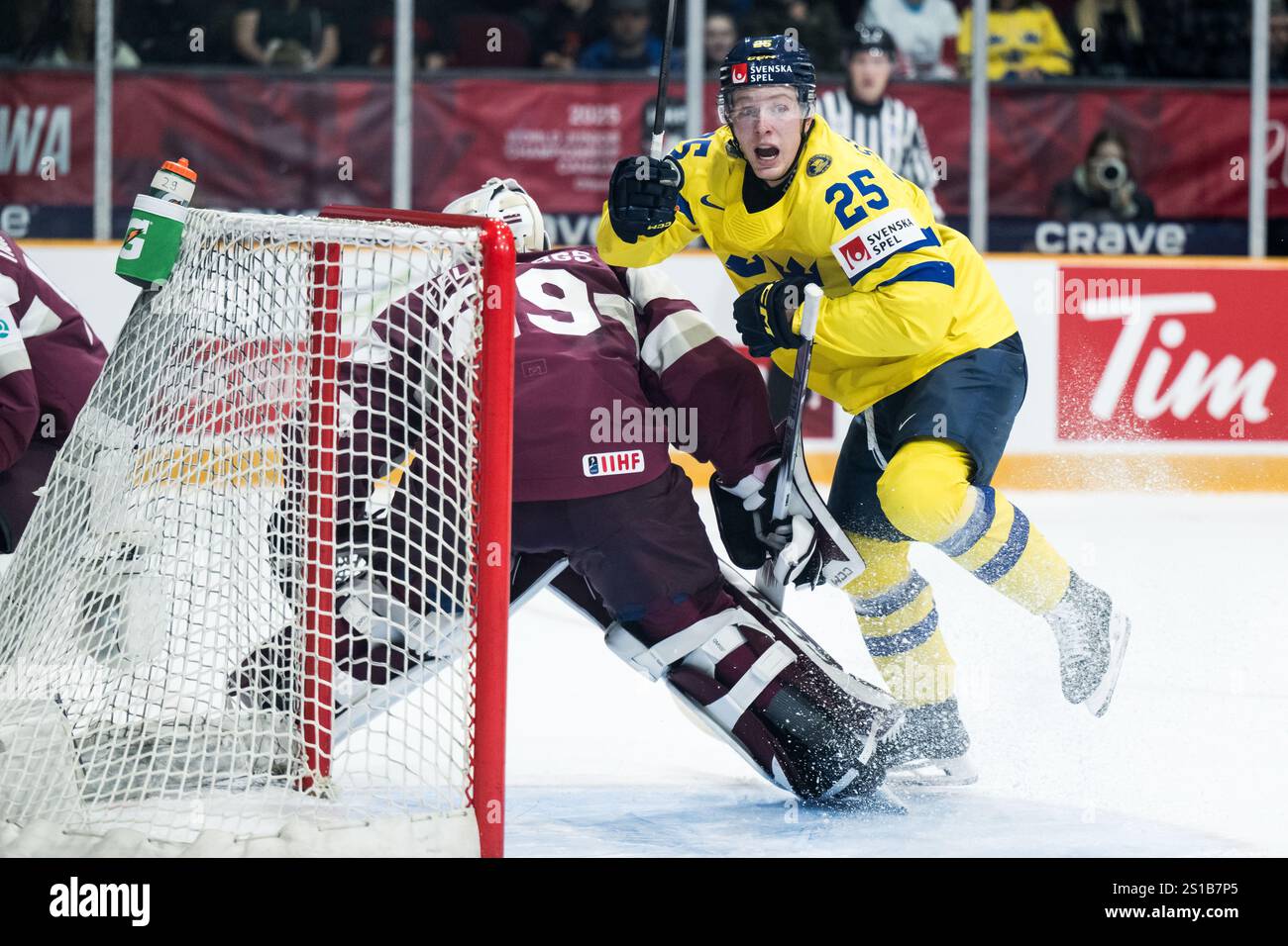 Goaltender Linards Feldbergs of, Latvia. , . and Otto Stenberg of ...