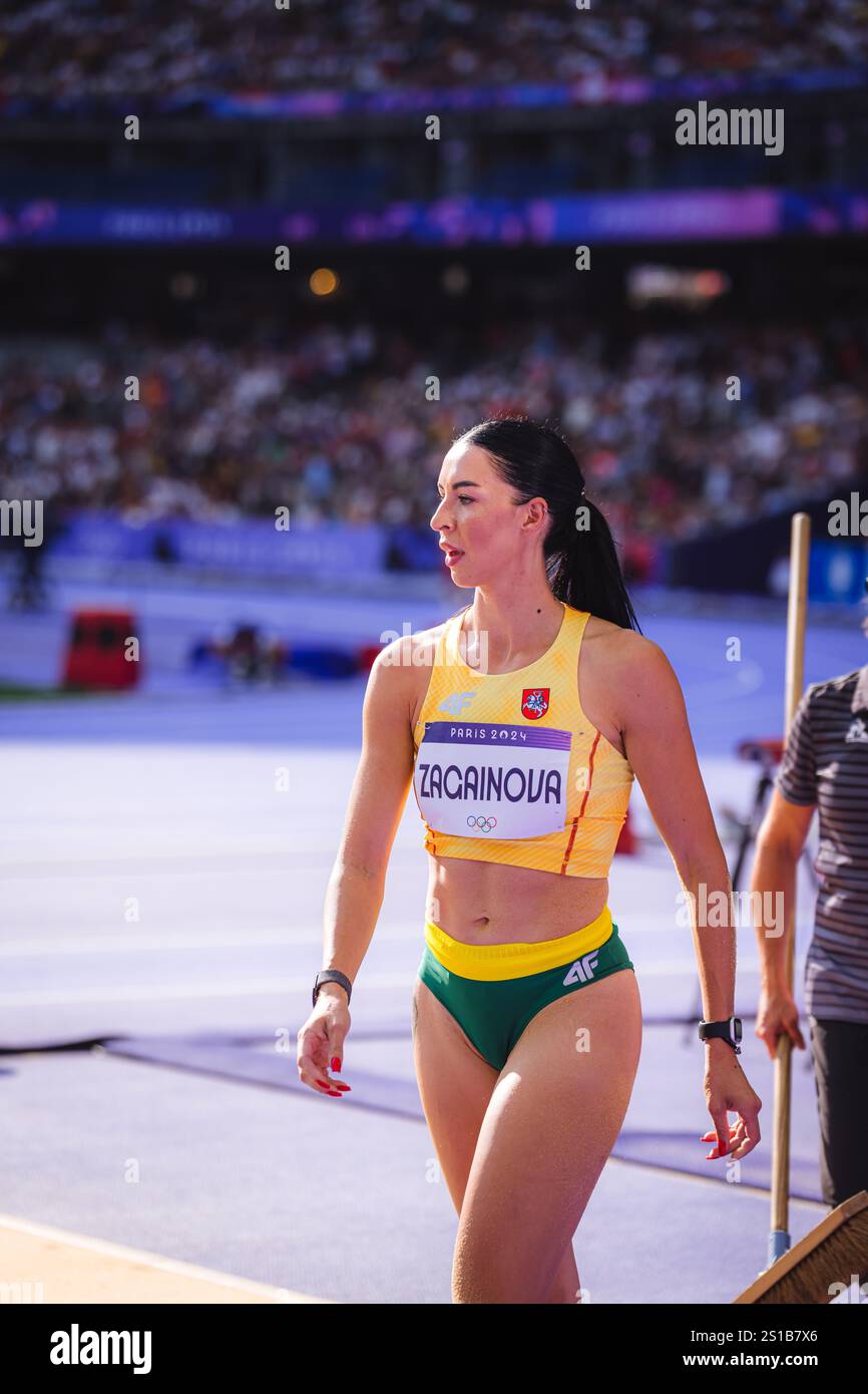 Diana Zagainova celebrating her medal with her country's flag at the ...