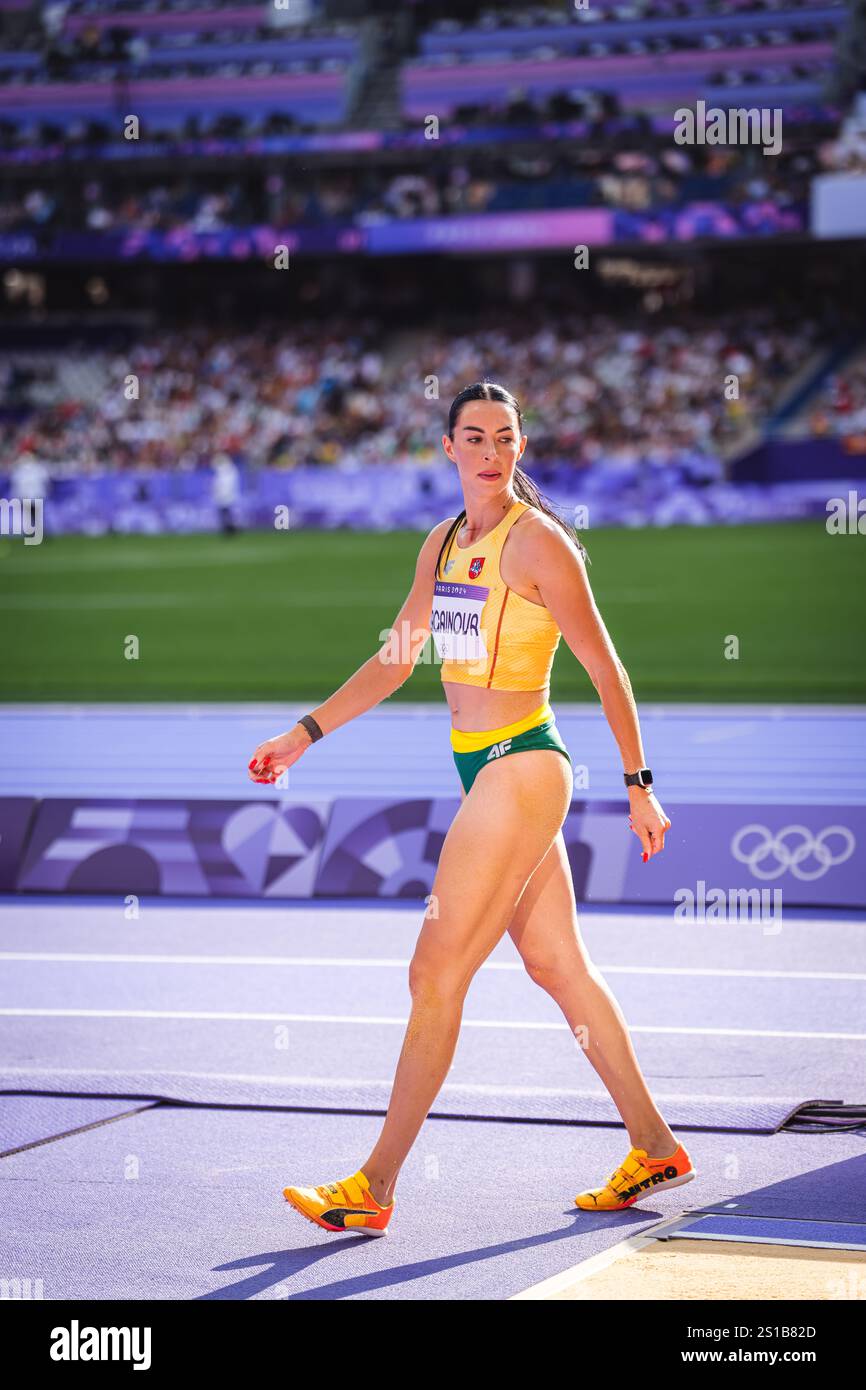 Diana Zagainova celebrating her medal with her country's flag at the ...