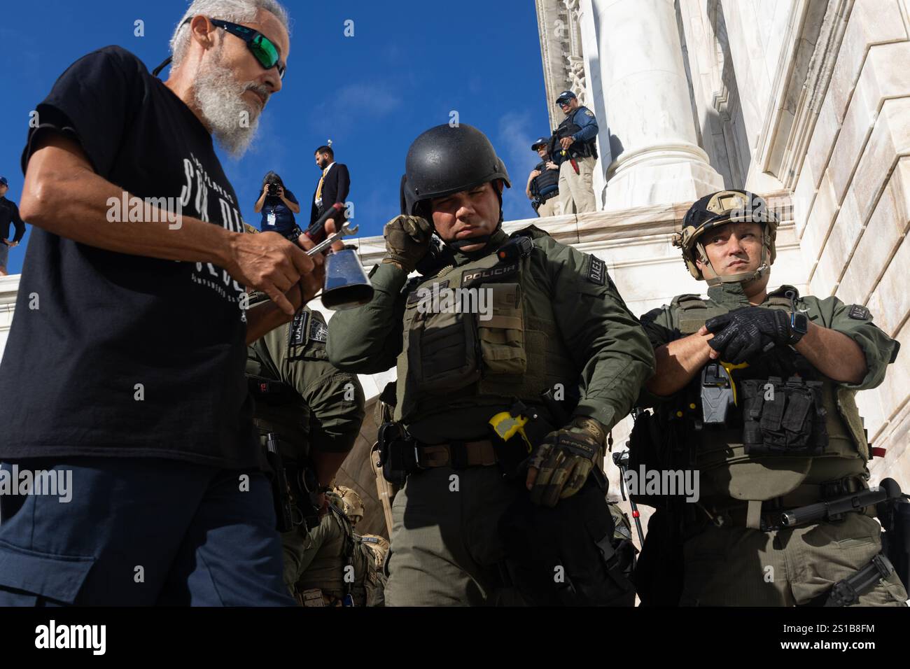 San Juan, USA. 02nd Jan, 2025. Environmental activists face off with ...