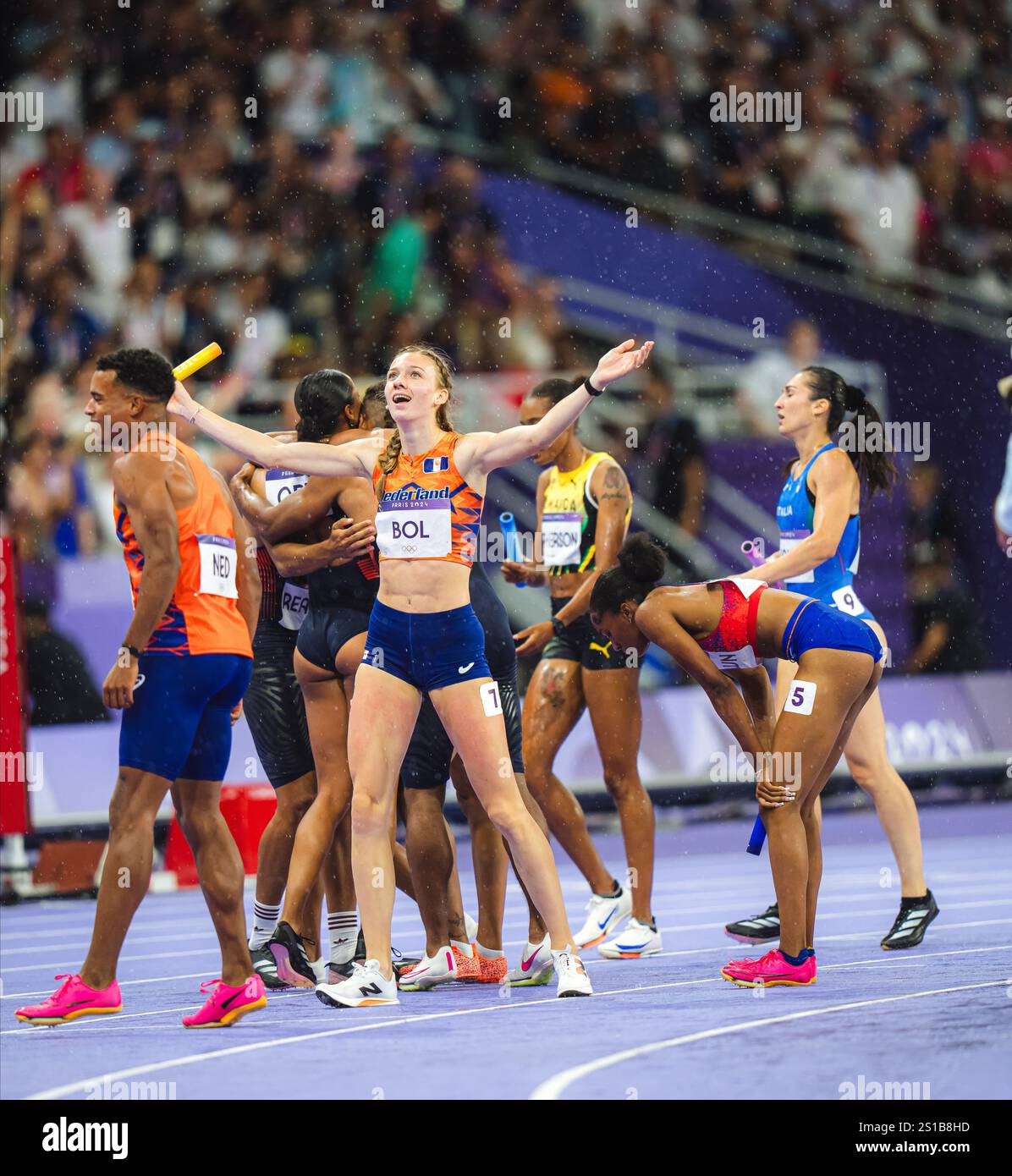 Femke Bol celebrating with her country's flag in the 4x400 meters Mix ...