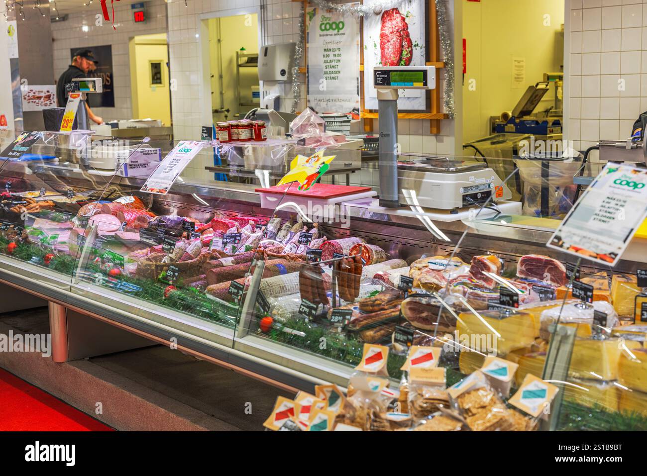 Deli counter with variety of sausages, ham, and premium meat delicacies ...