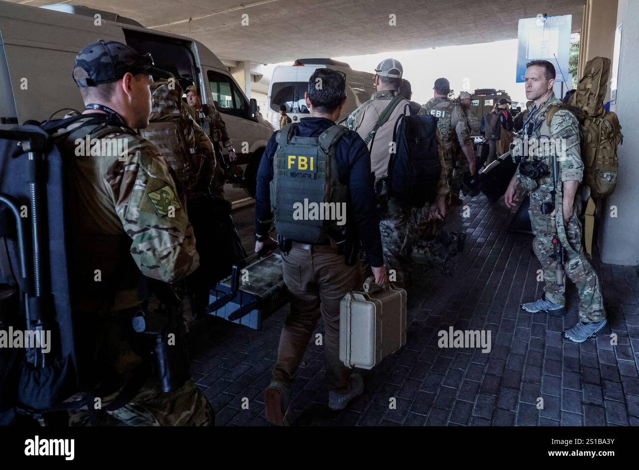 FBI personnel arrive at the Caesars Superdome ahead of the Sugar Bowl ...