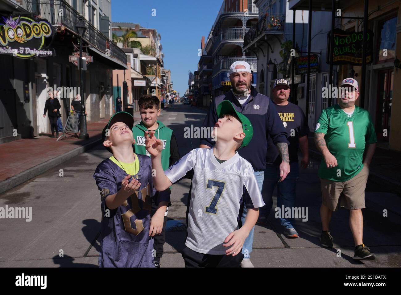 Cory Hunter throws a coin in the air on Bourbon Street, Thursday, Jan ...