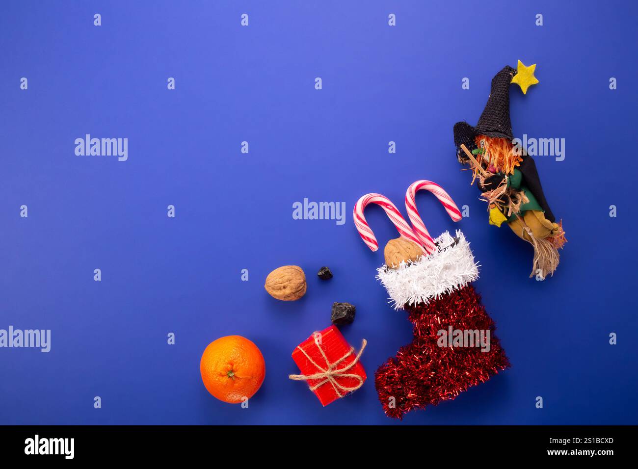 Epiphany day tradition. Befana and red stocking with sweet coal and ...