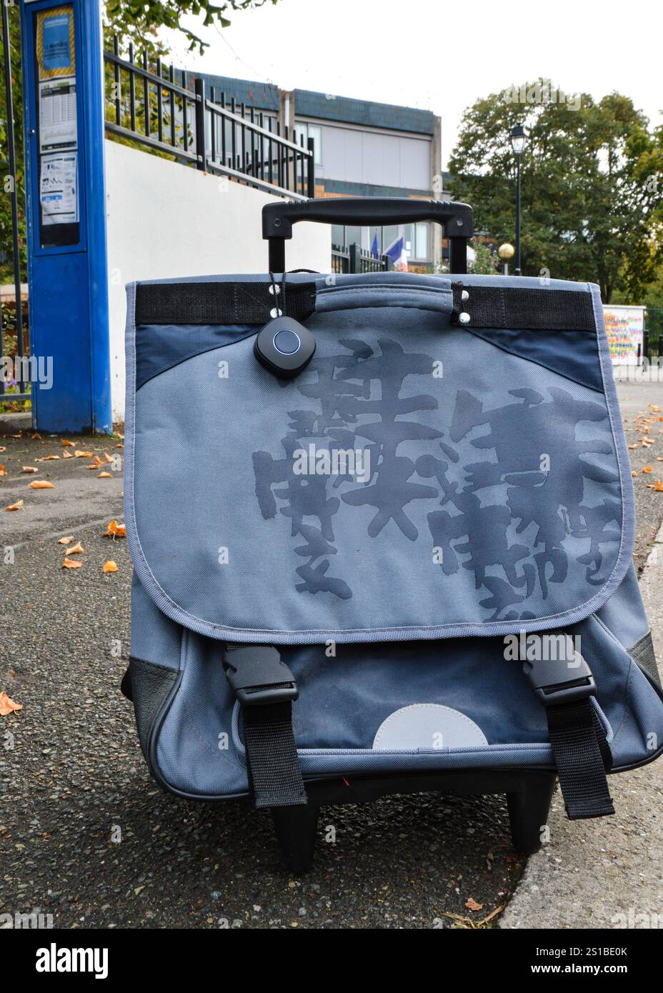 A gps tracker on a child’s school bag for real-time tracking Stock ...