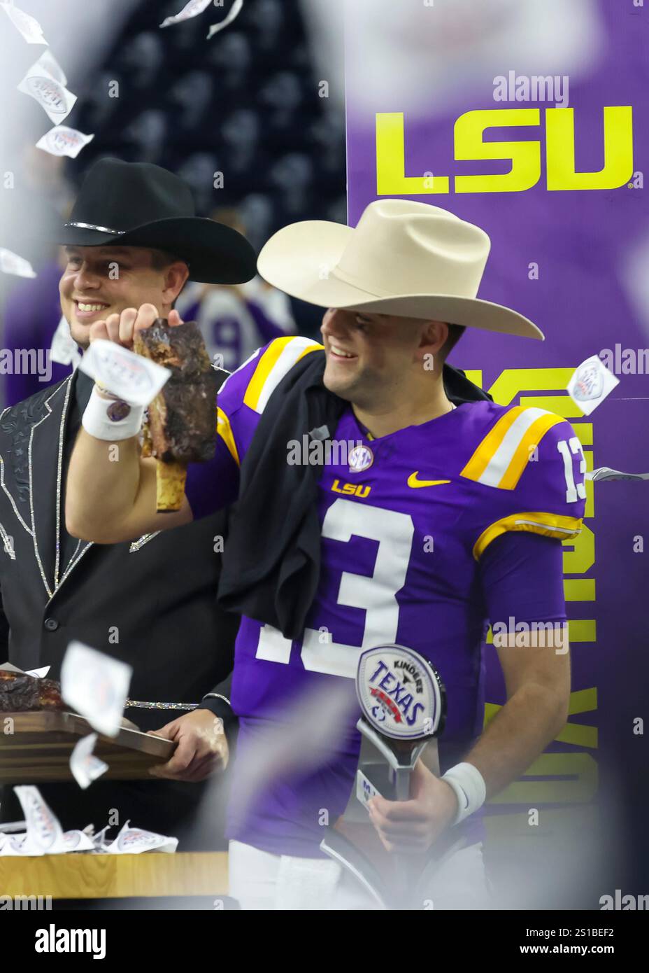 HOUSTON, TX - DECEMBER 31: LSU Tigers quarterback Garrett Nussmeier (13) prepares to take a bite ...