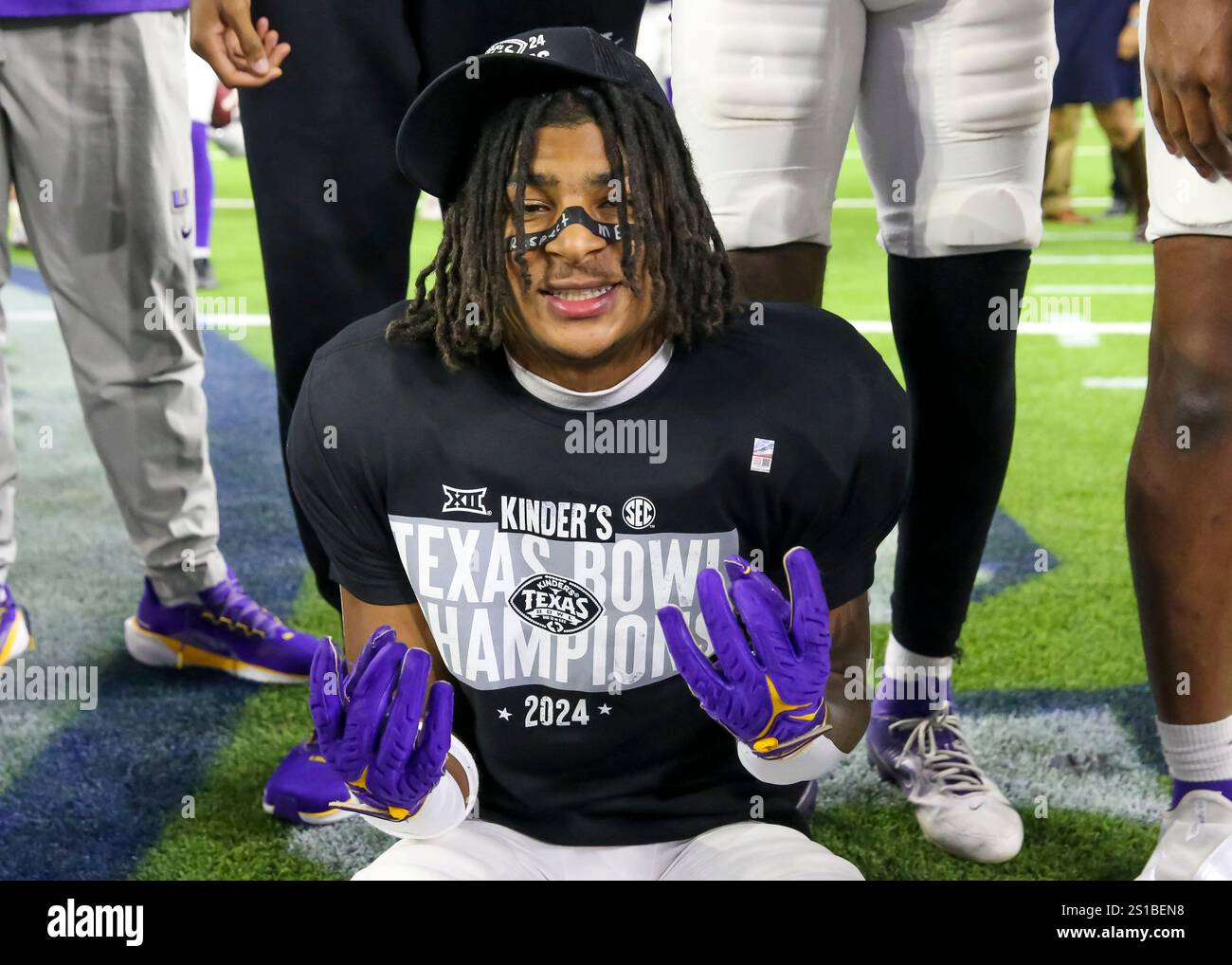 HOUSTON, TX - DECEMBER 31: LSU Tigers cornerback Wallace Foster IV (29) shows off championship ...