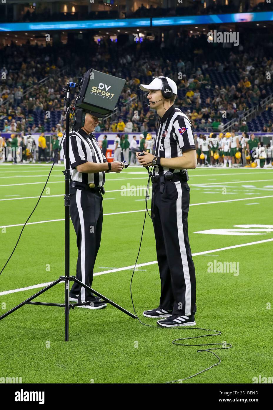 HOUSTON, TX - DECEMBER 31: Referee Justin Elliott reviews a turnover ...
