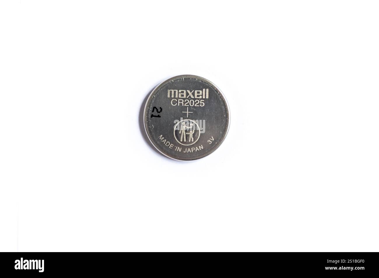 CR2025 button cell lithium battery 3V maxell isolated Stock Photo - Alamy