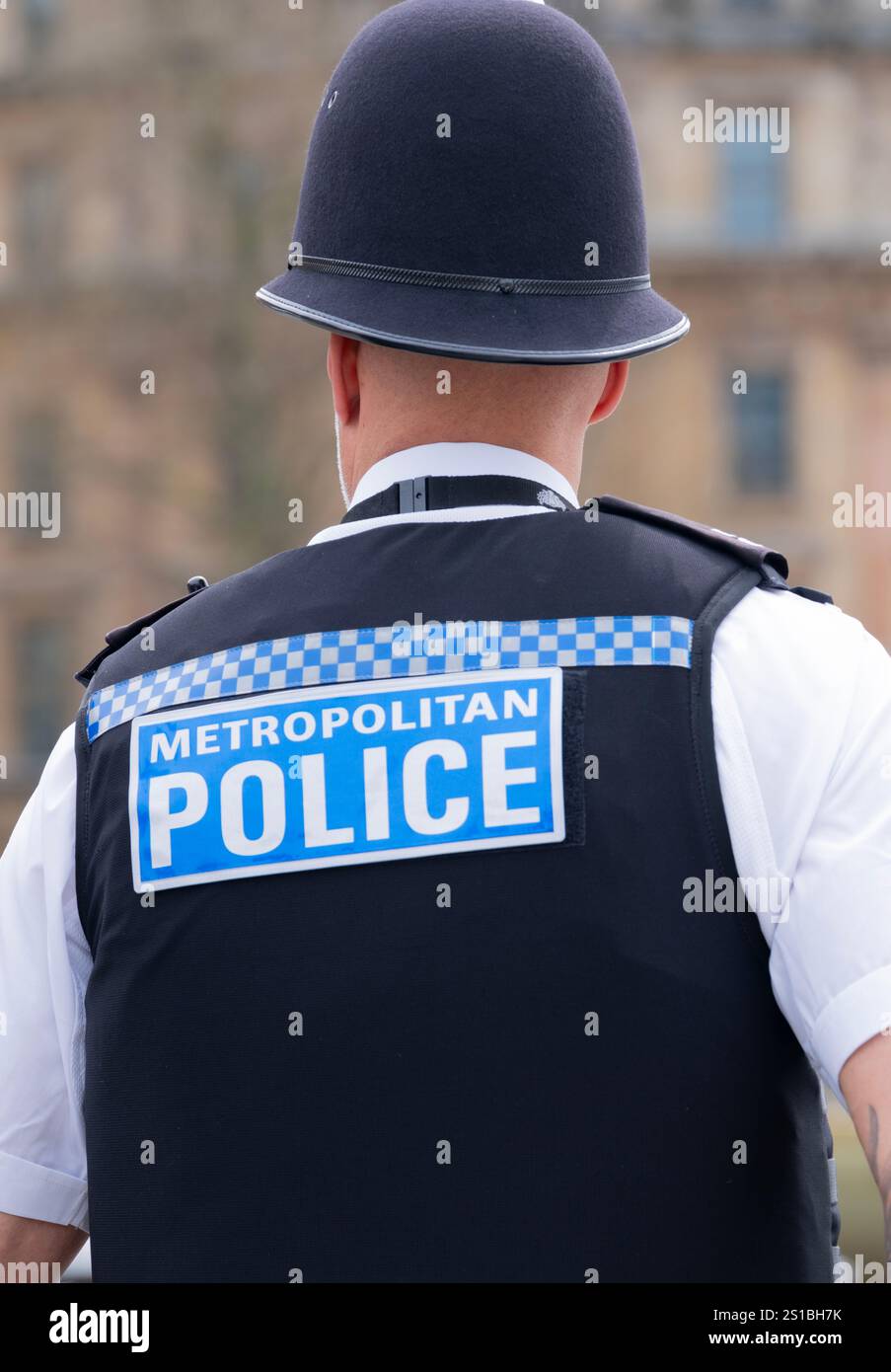 London, UK. 6th April 2024. Rear view of a Metropolitan Police officer ...