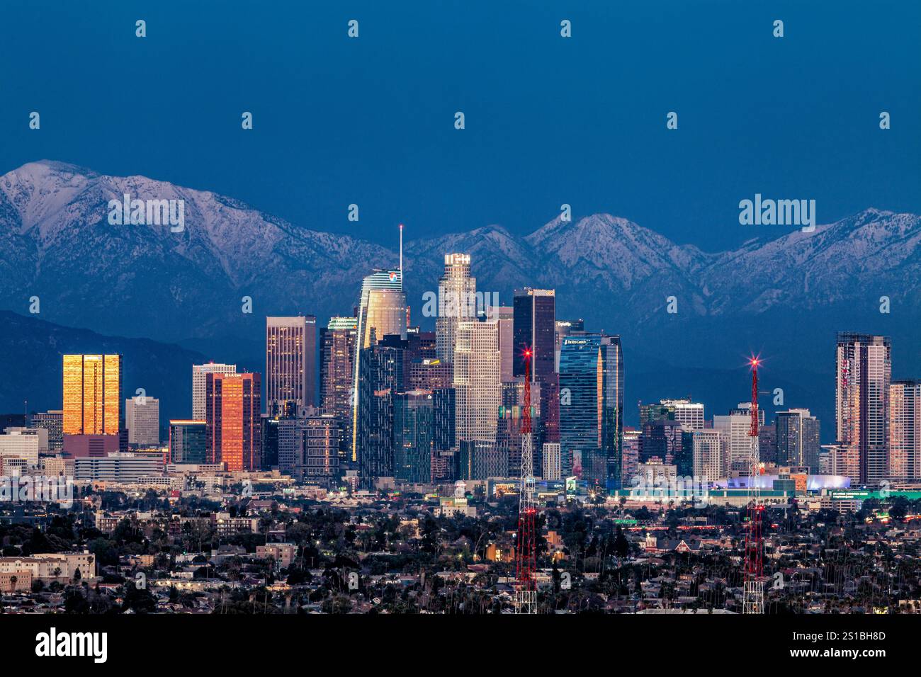Los Angeles Skyline with snow covered San Gabriel Mountains in ...