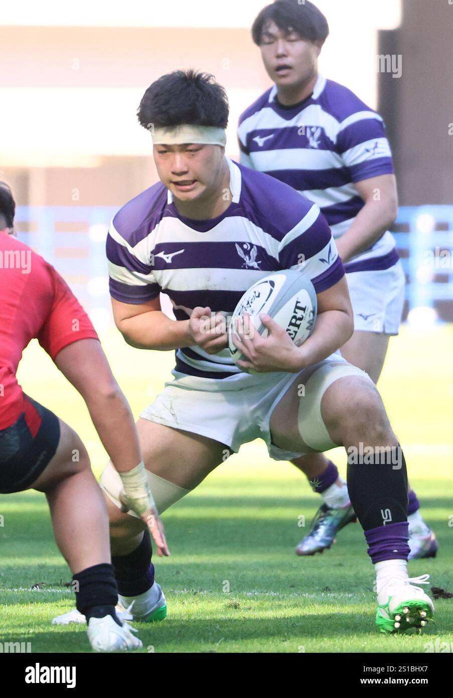 January 2, 2025, Tokyo, Japan - Meiji University lock Daichi Sato carries the ball during the ...