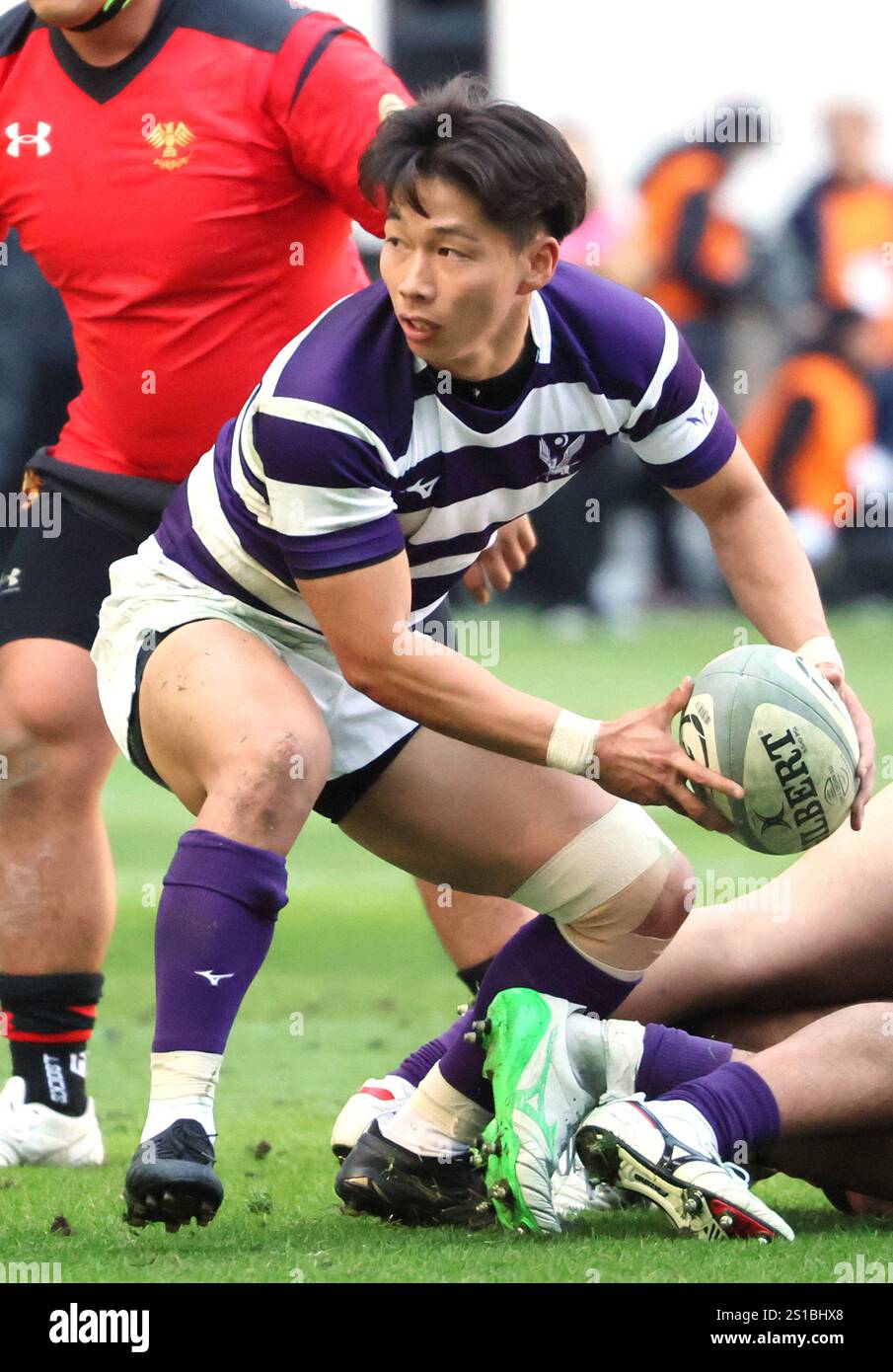 January 2, 2025, Tokyo, Japan - Meiji University scrum half Ryusei Shibata passes the ball ...