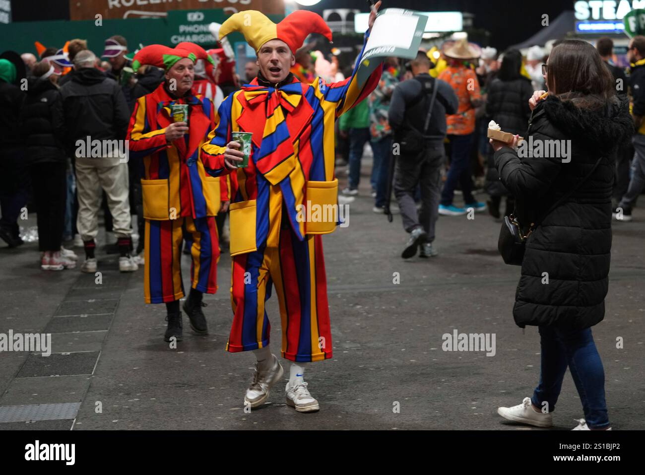 Fans dressed in costumes are seen around the fan village before the ...