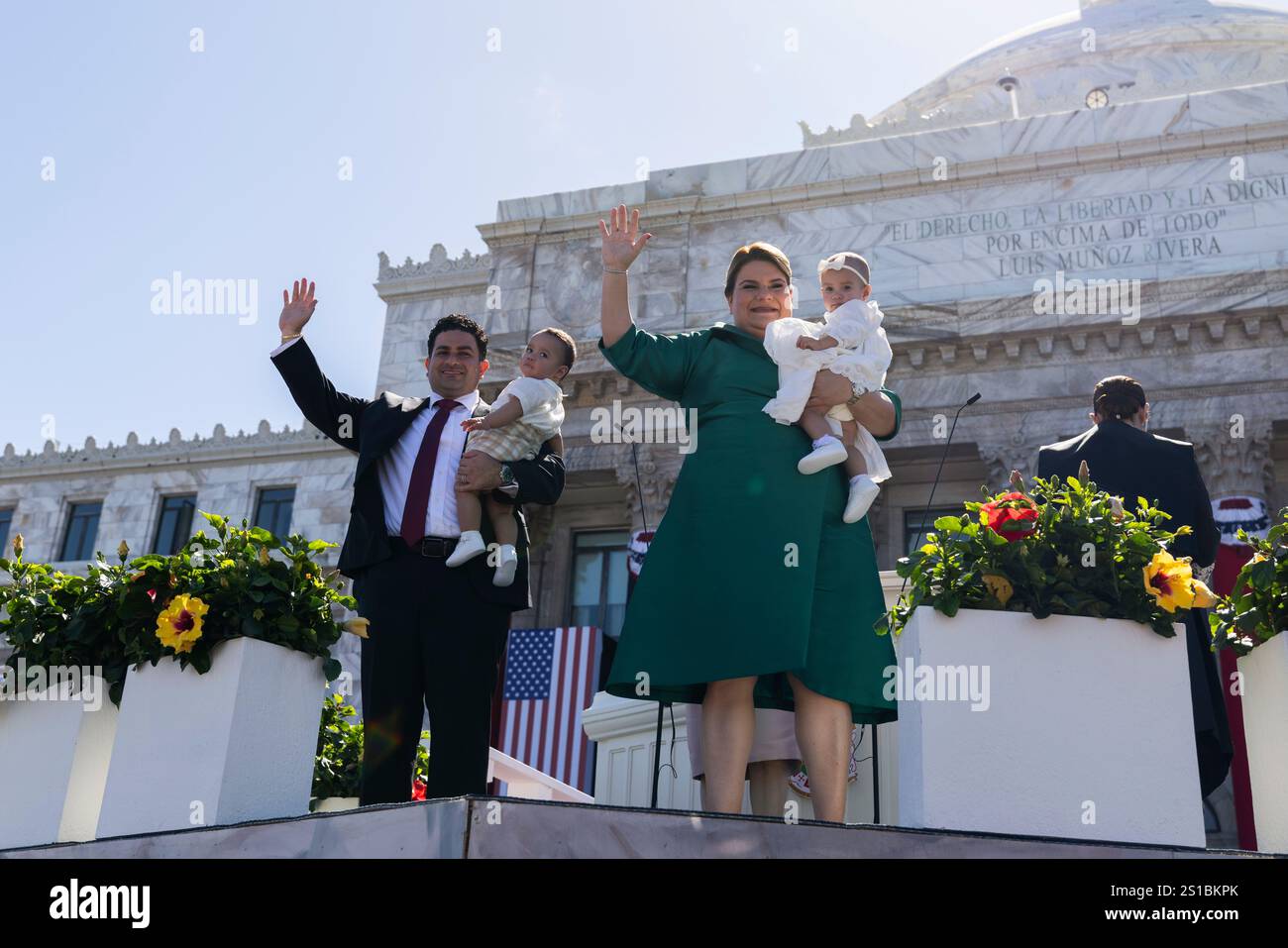 Jenniffer Gonzalez Colon and her husband Jose Yovin Vargas wave with ...