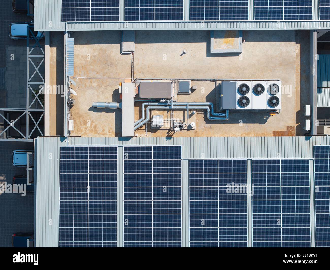 air conditioning industrial in top of a building roof, ac unit and pipe ...