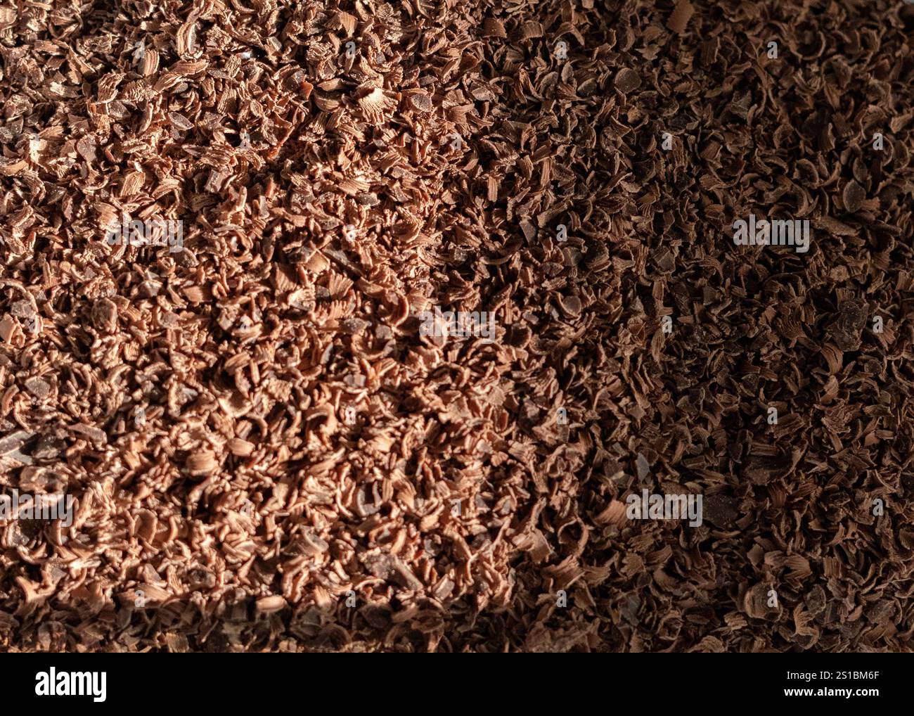 photo shows a pile of grated chocolate. The texture and color are ...