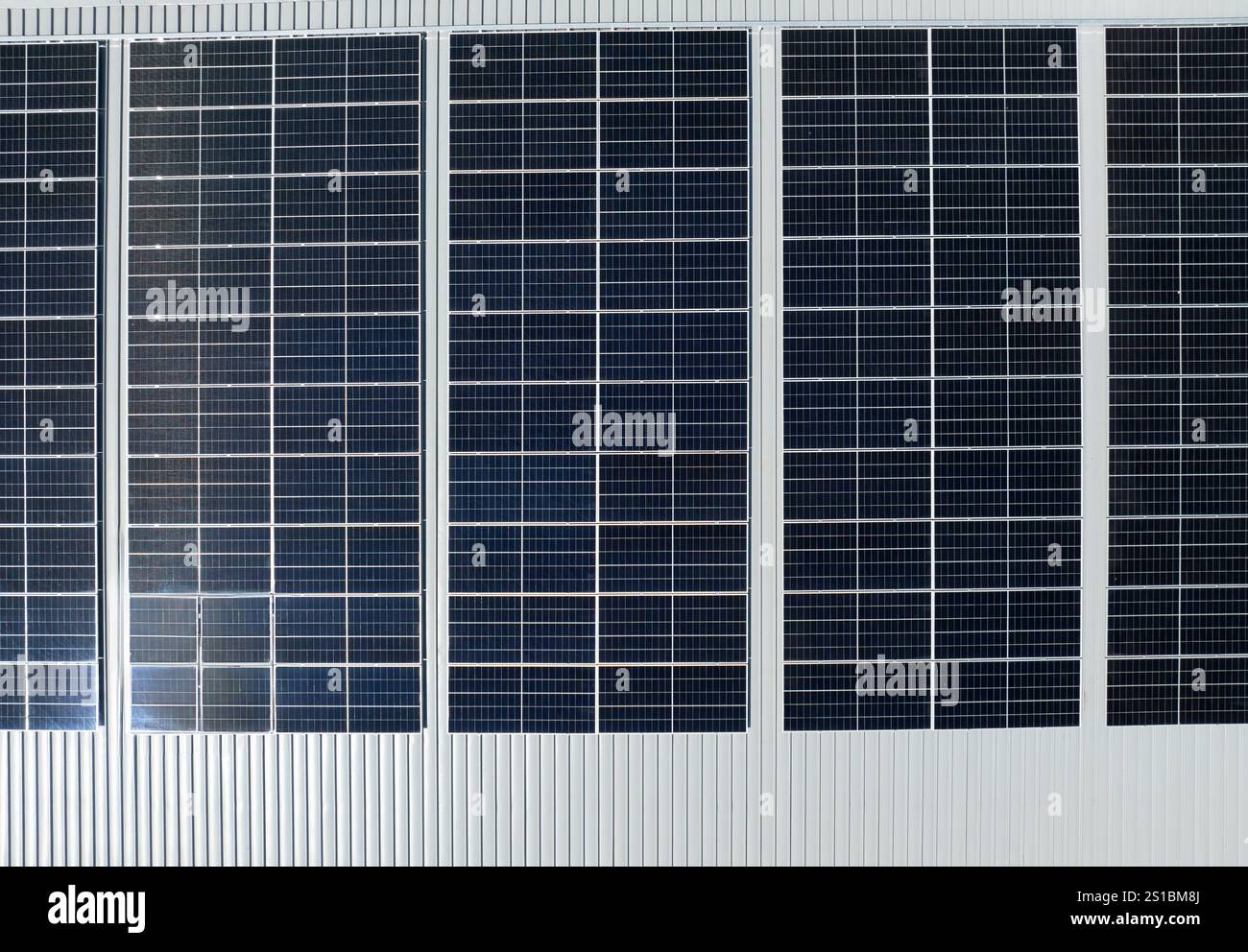 close up solar panels cells , in top of a building roof, top down view ...