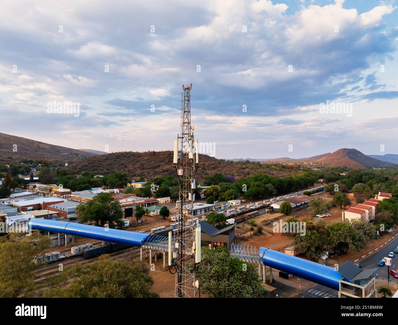 aerial view, cellular antenna at sunset, communications tower, mountain ...