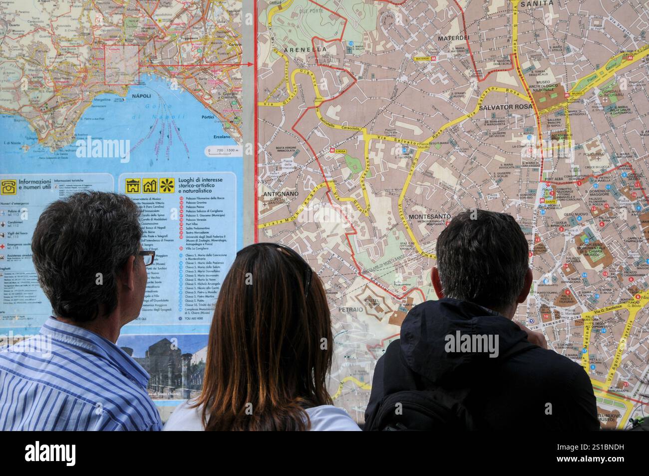 Tourists read a topographic map of the historic center of Naples on Via Toledo Stock Photo - Alamy