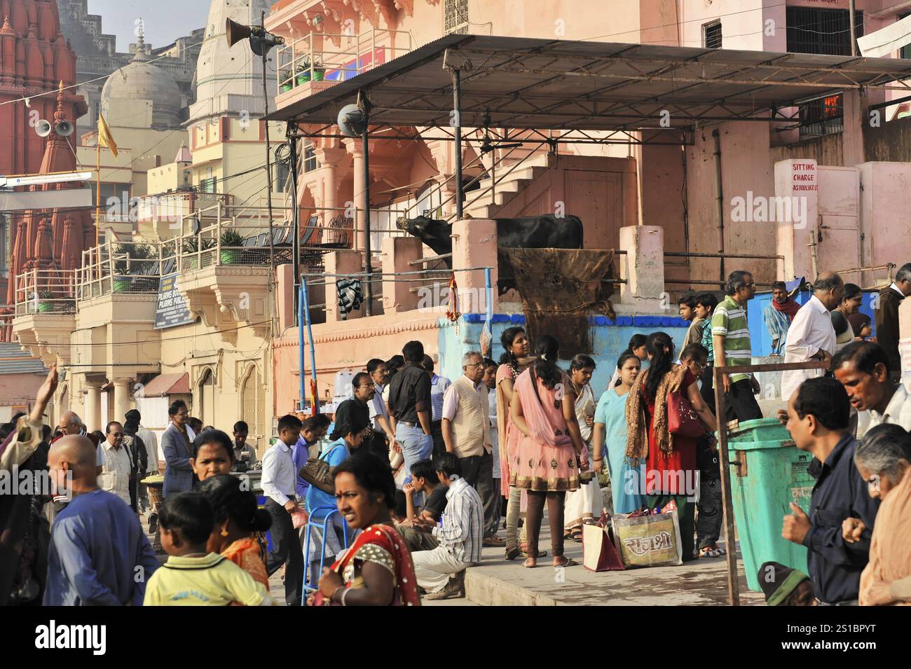 Varanasi, Uttar Pradesh, India, Asia, A busy alley with people in front ...