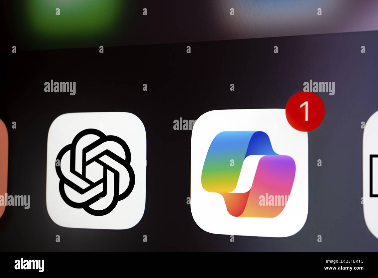 A close up of an iPhone screen displaying the Chatgpt and Microsoft copilot app icon Stock Photo ...