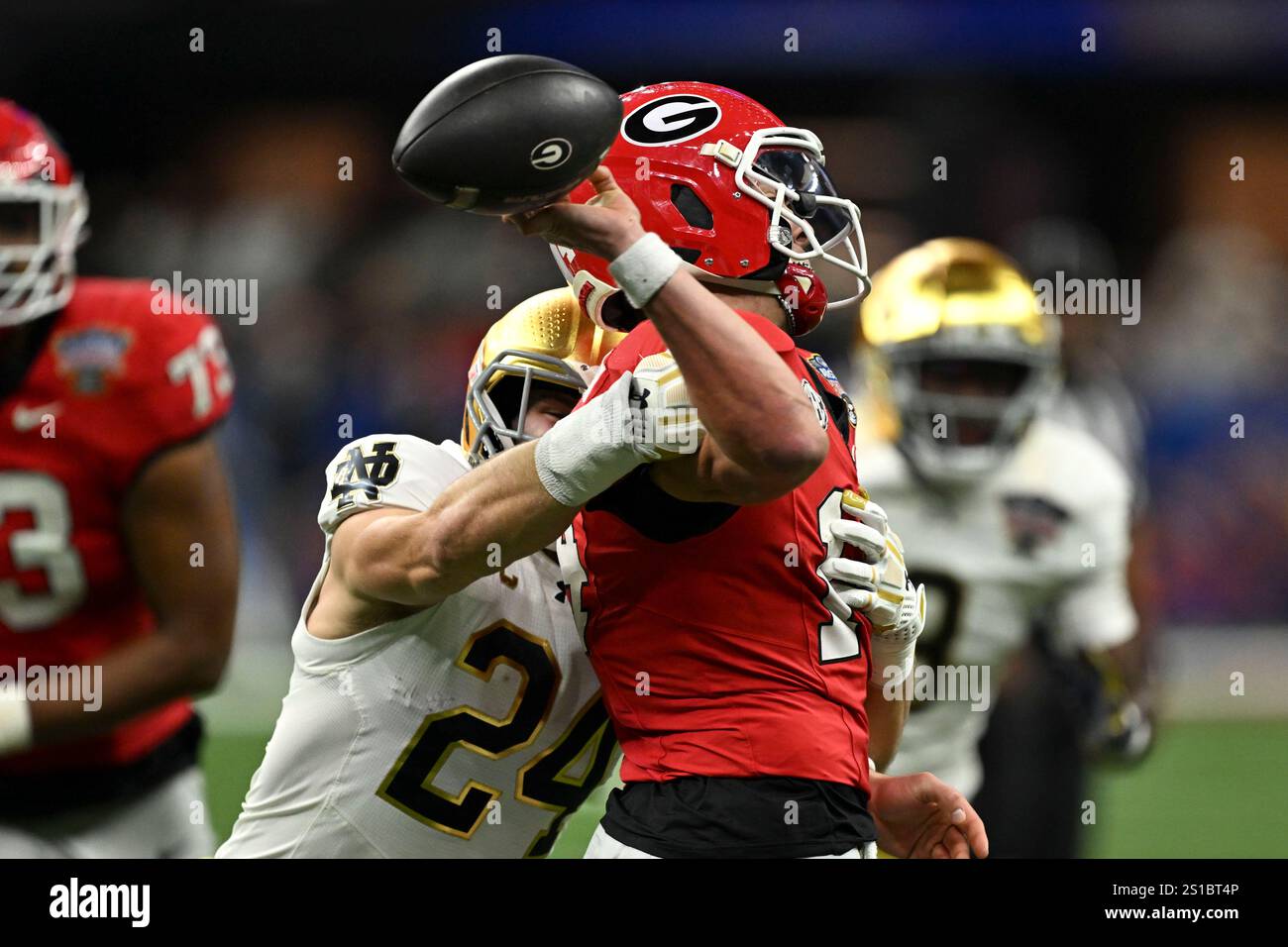 Georgia quarterback Gunner Stockton fumbles as he is hit by Notre Dame ...