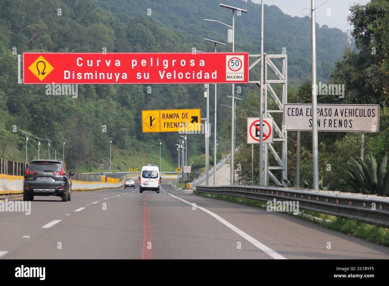 Sign on the highway to indicate a braking ramp to stop vehicles that ...