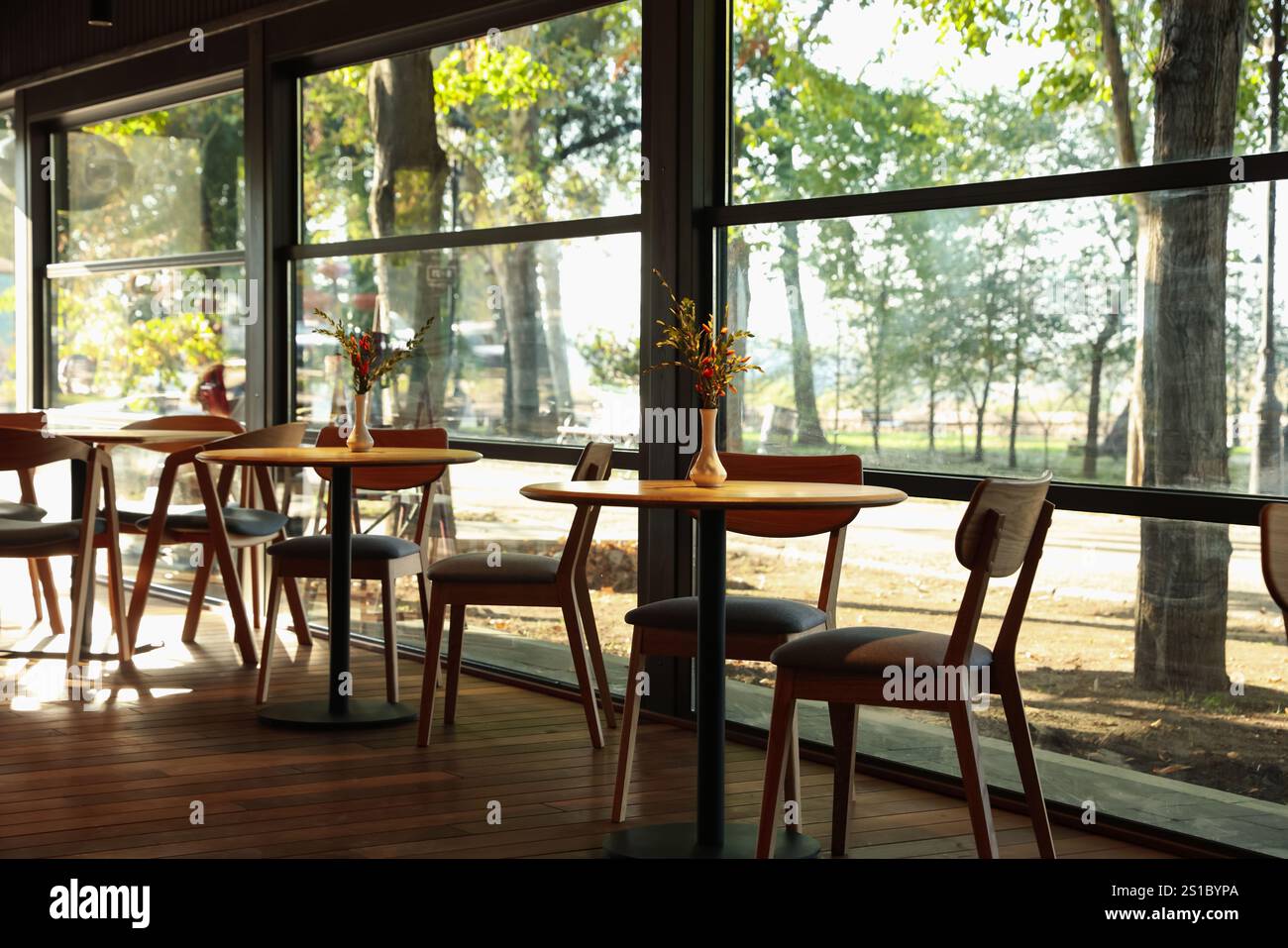 Stylish cafe with large windows. Interior design Stock Photo - Alamy