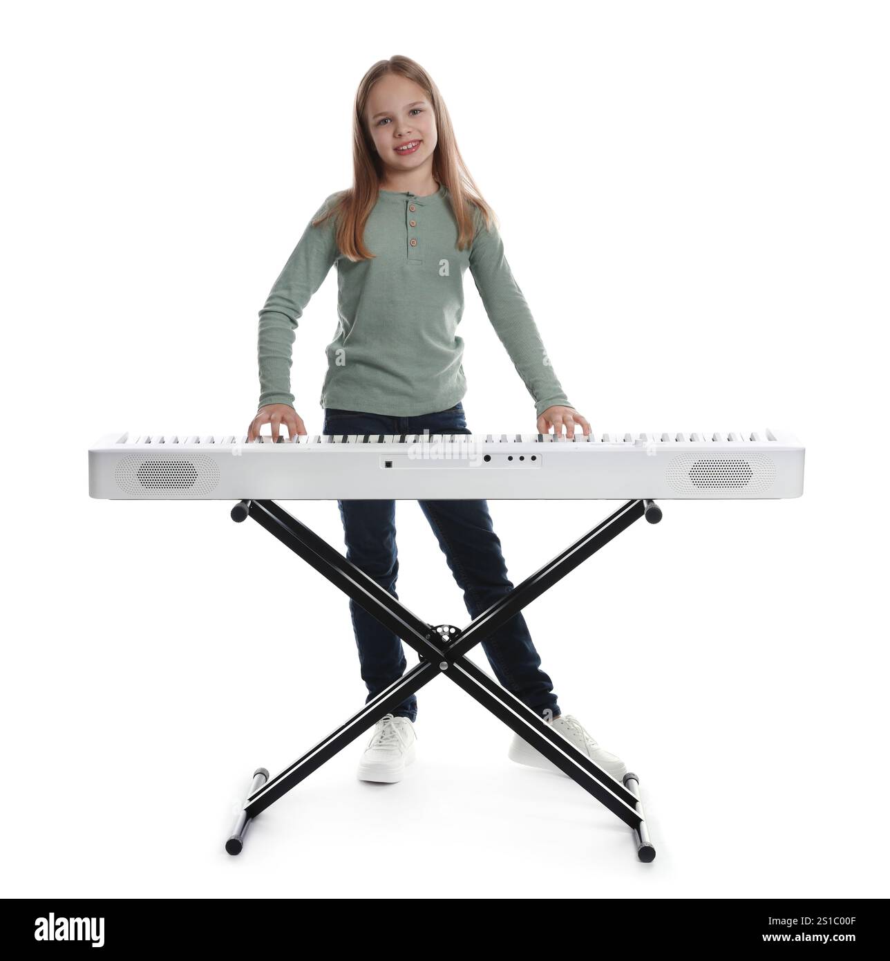 Cute girl playing synthesizer on white background Stock Photo - Alamy