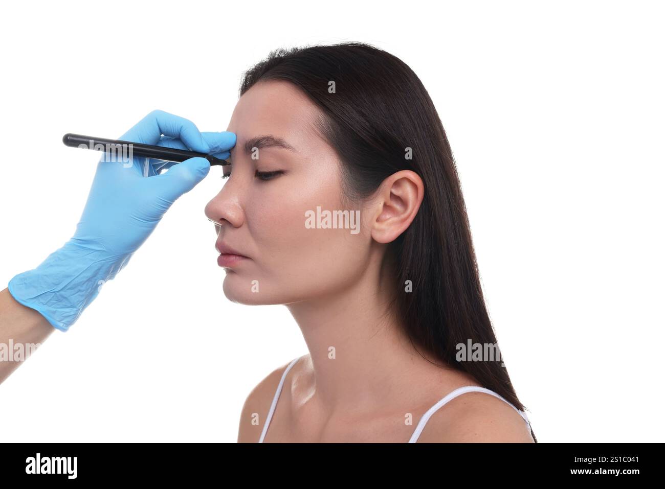 Doctor drawing marks on patient's nose for plastic surgery operation ...